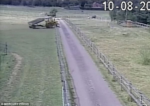 Catch me if you can farmer chases a runaway tractor as it crashes into ...
