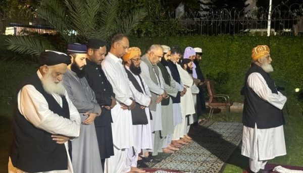 PTI leaders offer Maghrib prayers behind Maulana Fazlur Rehman